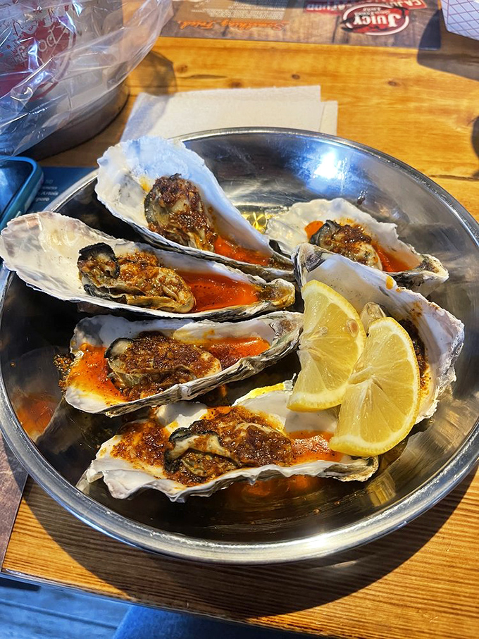 These baked oysters glisten with savory sauce and lemon brightness. Each shell cradles a little ocean miracle waiting to be discovered.