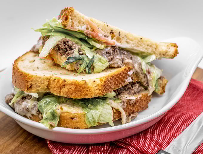 This isn't just a sandwich—it's an architectural marvel of meat, cheese, and veggies between toasted bread. The Guggenheim of lunch, if you will.