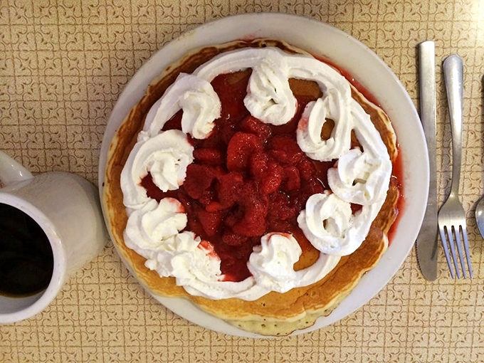 Strawberry pancakes with whipped cream swirls aren't just breakfast&mdash;they're dessert with permission to eat it at 9 AM.