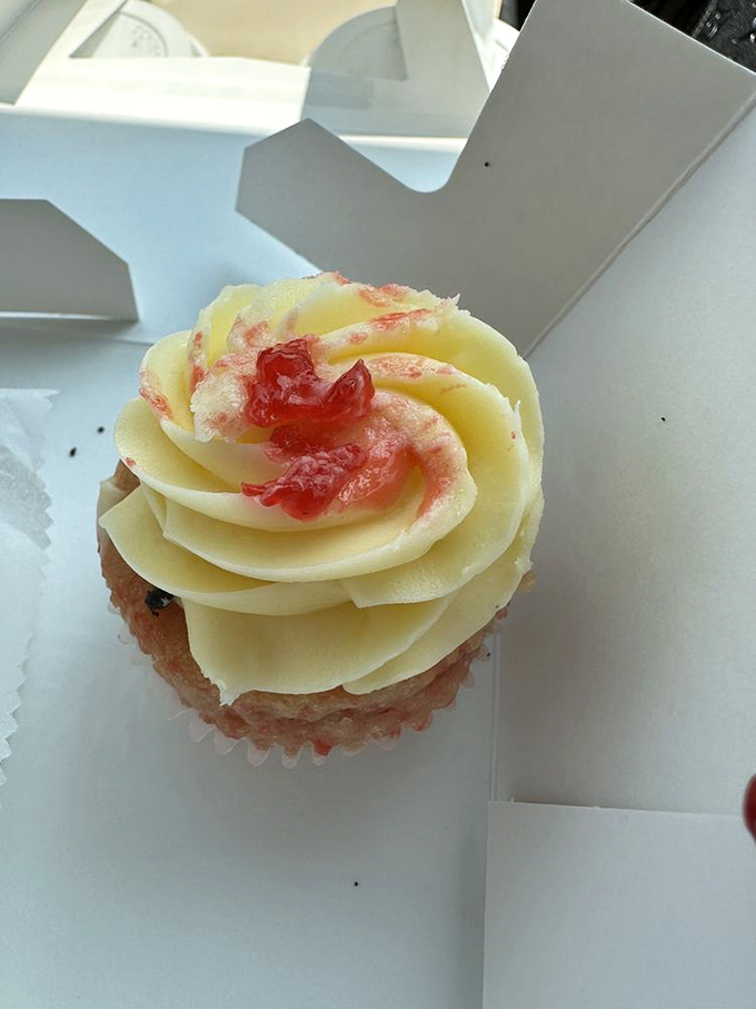 A cupcake so pretty you almost don't want to eat it. Almost. That swirl of frosting is basically daring you to dive in.