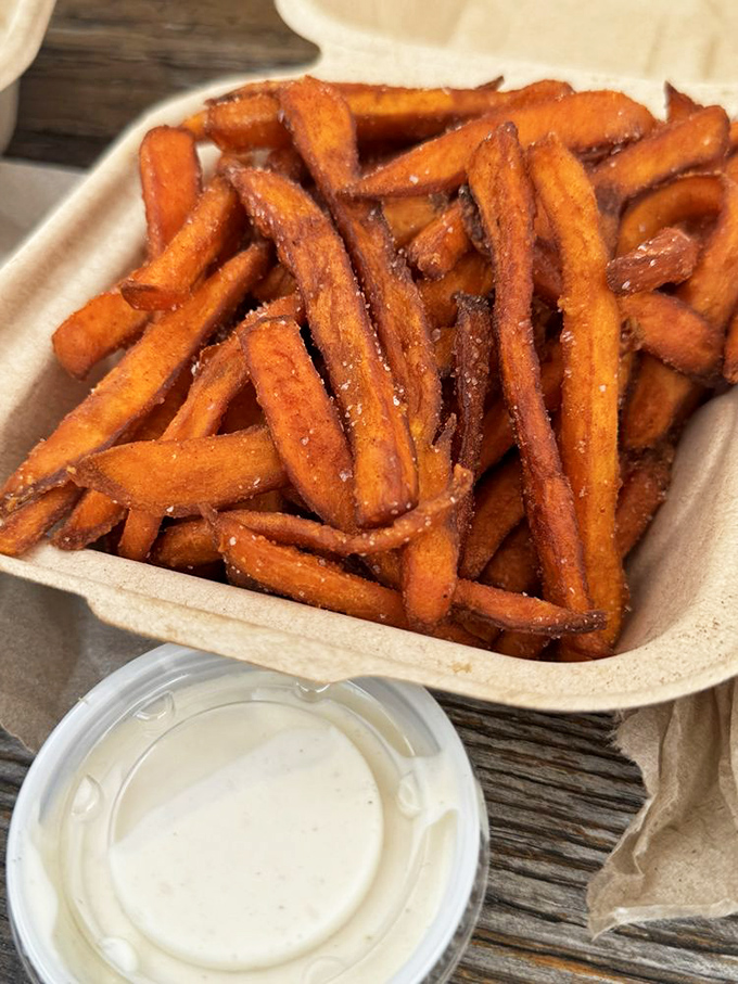 Sweet potato fries with dipping sauce&mdash;the supporting actor that sometimes steals the scene from the burger star.