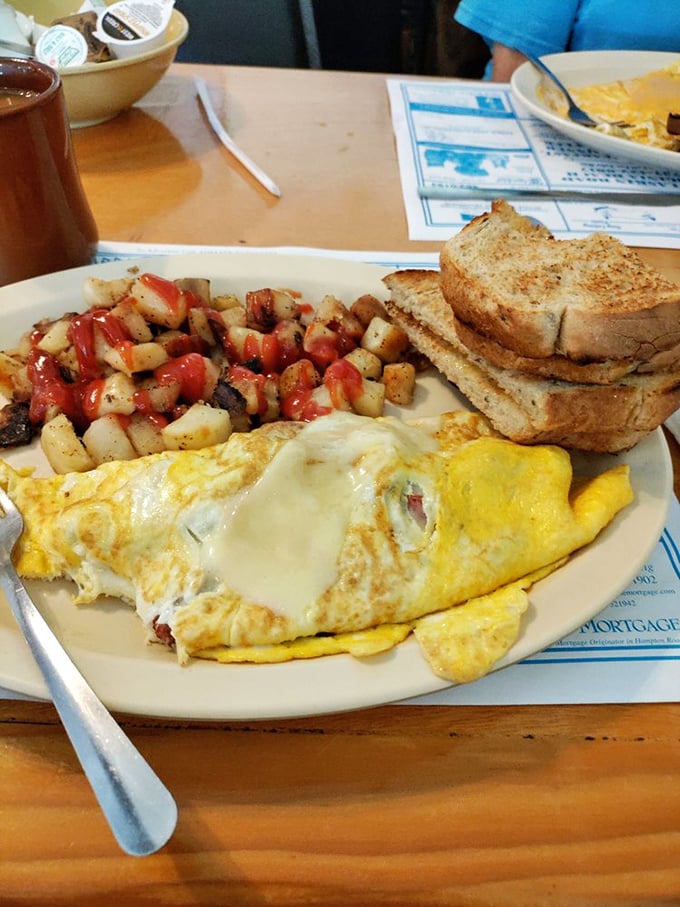 This isn't just breakfast, it's morning therapy &ndash; a cheesy omelet, crispy potatoes, and toast that's been kissed by the perfect amount of butter.
