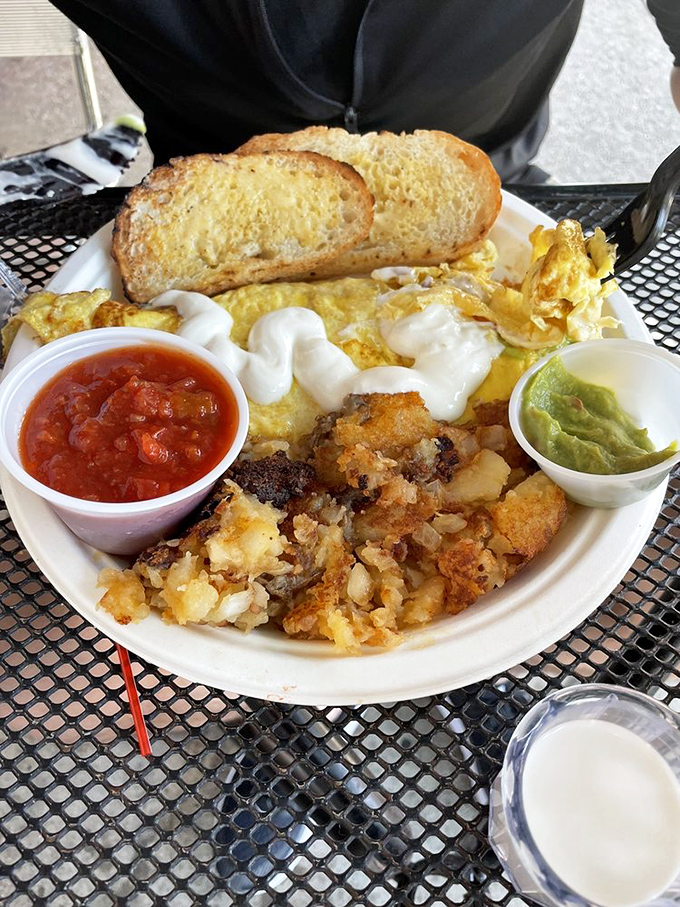 This isn't just an omelet&mdash;it's a cheese-covered landscape of southwestern flavors with tortillas standing by for transport duty. Breakfast geography at its finest.