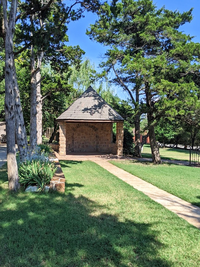 The Grove stands like a storybook gazebo, where Oklahoma breezes rustle through pine trees that have witnessed countless celebrations.