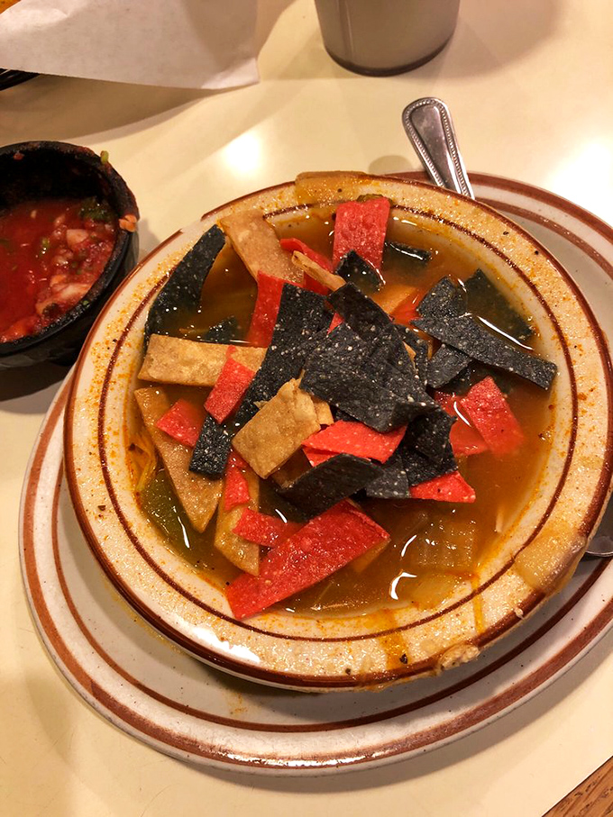 Tortilla soup that's a fiesta in a bowl. Those colorful tortilla strips aren't just garnish&mdash;they're confetti celebrating the rich broth beneath.