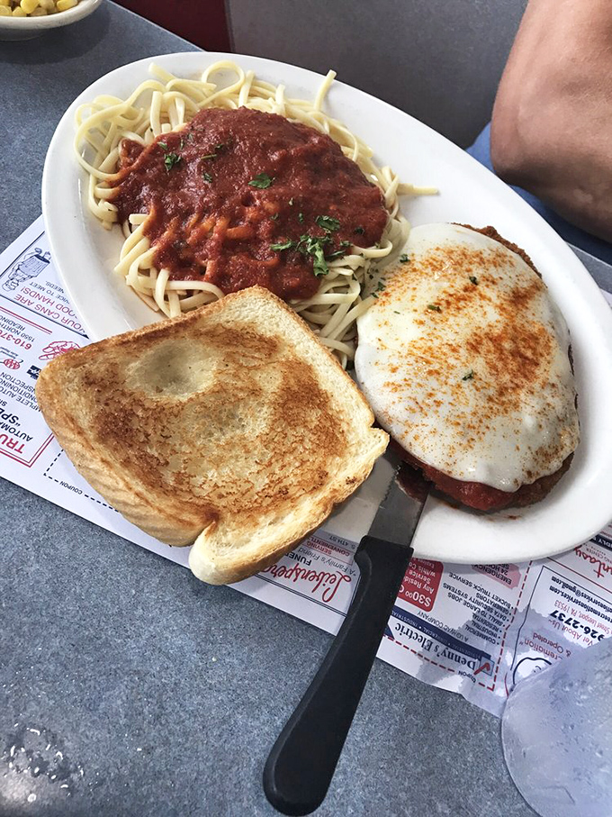 Counter seating: where solo diners get front-row tickets to the short-order ballet. The blue lighting adds a touch of unexpected cool. 
