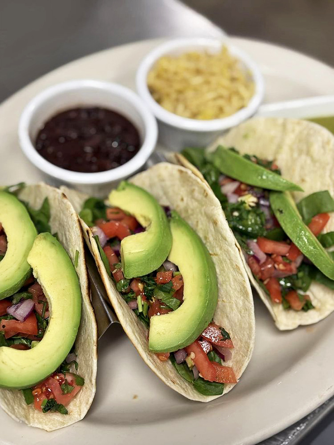 Vegetarian tacos that could convert carnivores. Those avocado slices aren't just toppings &ndash; they're buttery green exclamation points of deliciousness.