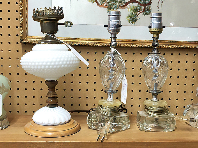 These vintage lamps once illuminated conversations now lost to time. The hobnail milk glass piece would transform any bedside table into a statement.