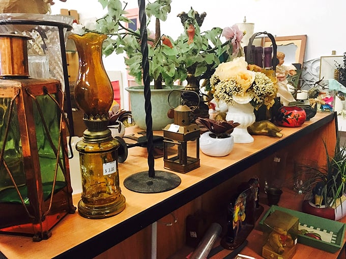 Amber glass lamps and artificial flowers create still-life vignettes that whisper, "I belonged in someone's living room in 1978."