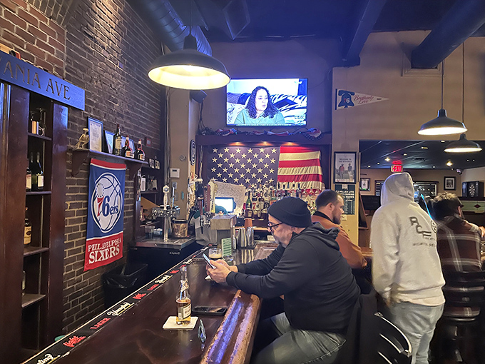 American flags and Philadelphia sports memorabilia create the perfect backdrop for locals to enjoy cold beers and hot takes.