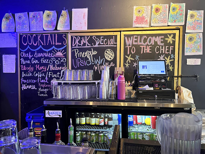 The bar's handwritten menu promises "Chef's Sunrise" and other morning cocktails&mdash;because sometimes pancakes need a spirited companion.