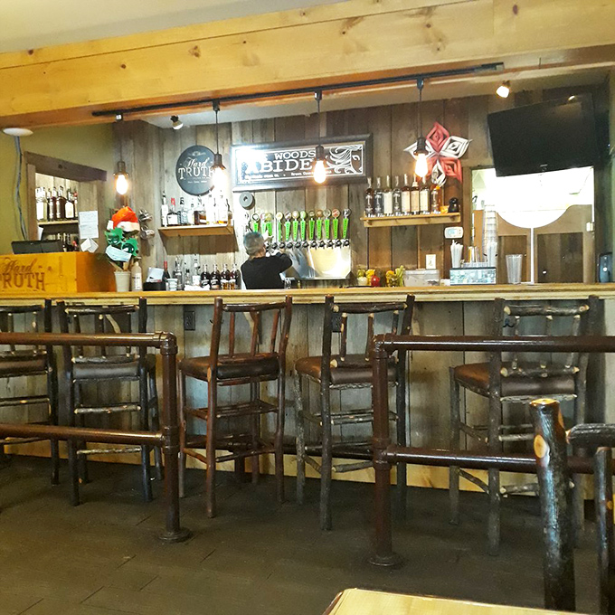 The bar area feels like the living room of that cool friend who somehow makes rustic look sophisticated. Weathered wood never looked so inviting.