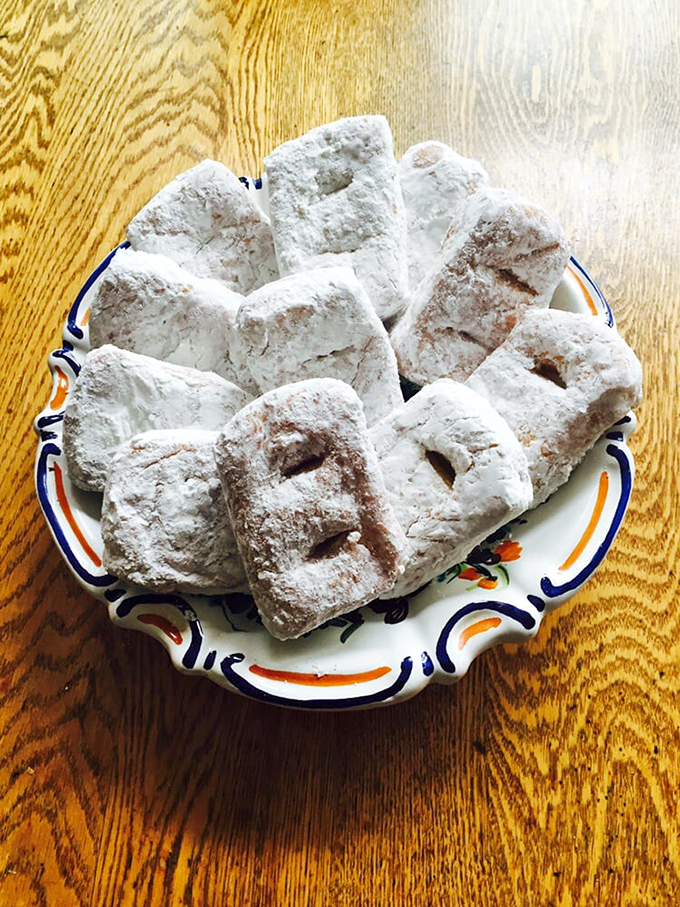 These powdered delights aren't just donuts&mdash;they're cloud-like vehicles for pure joy. Each one leaves evidence of happiness all over your shirt.