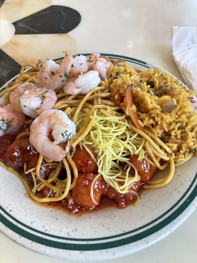 The art of buffet plate arrangement reaches masterpiece status with this harmonious blend of noodles, rice, and protein.