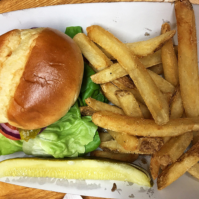 A burger that doesn't need Instagram filters, served with fries that clearly never met a freezer. Simple, honest food done right.