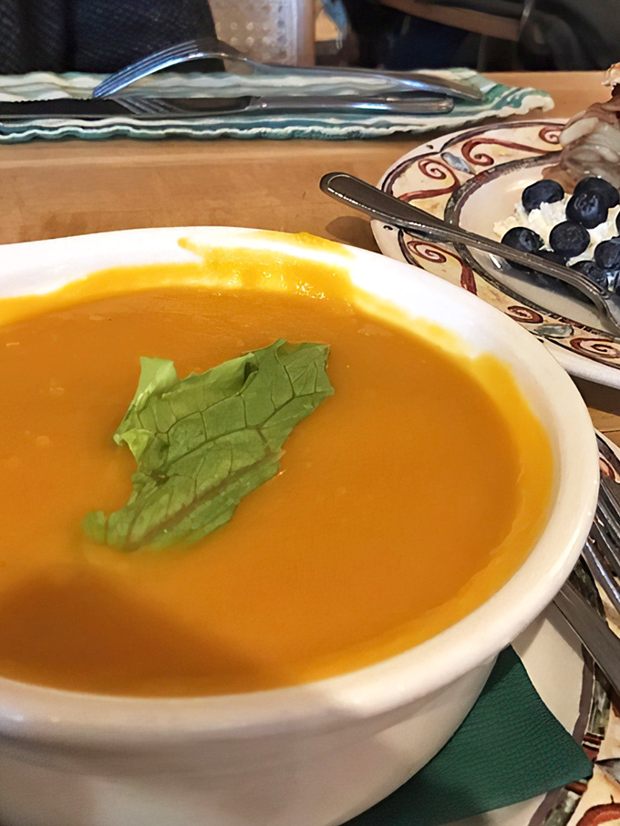 Butternut squash soup with a single mint leaf: proof that simplicity, when executed perfectly, is the ultimate sophistication.