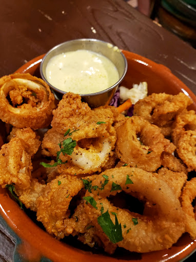 Calamari that defies the rubbery reputation of lesser versions. Crispy, golden rings with remoulade that makes you wonder why you'd eat anything else.