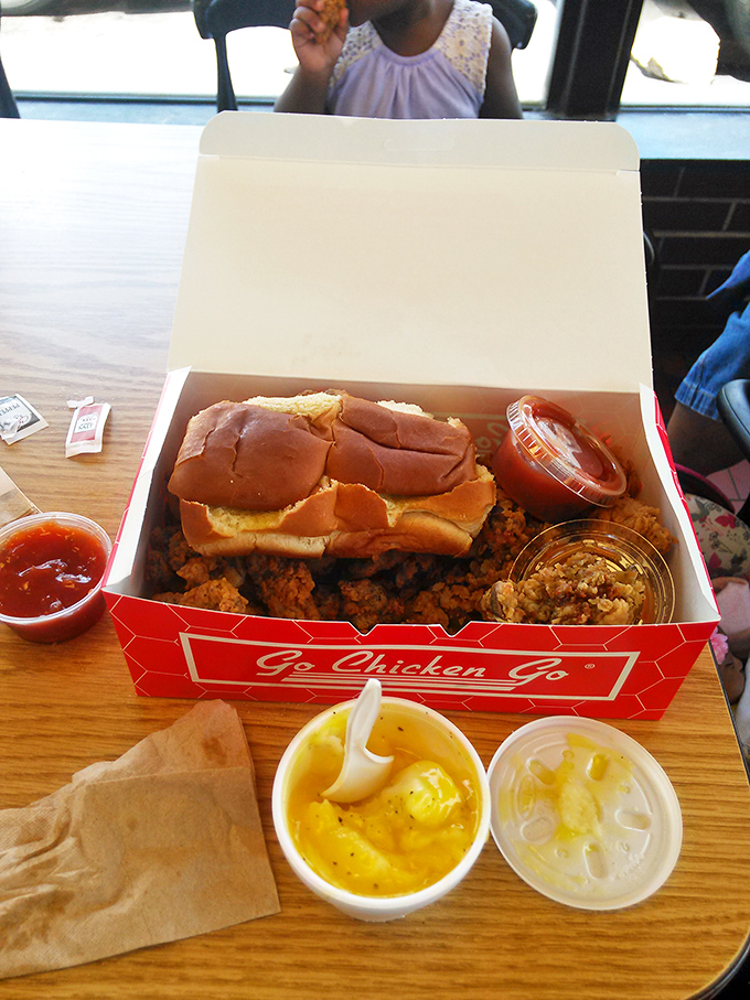 A feast fit for royalty served in a humble cardboard throne. The mac and cheese side is practically begging for your attention.