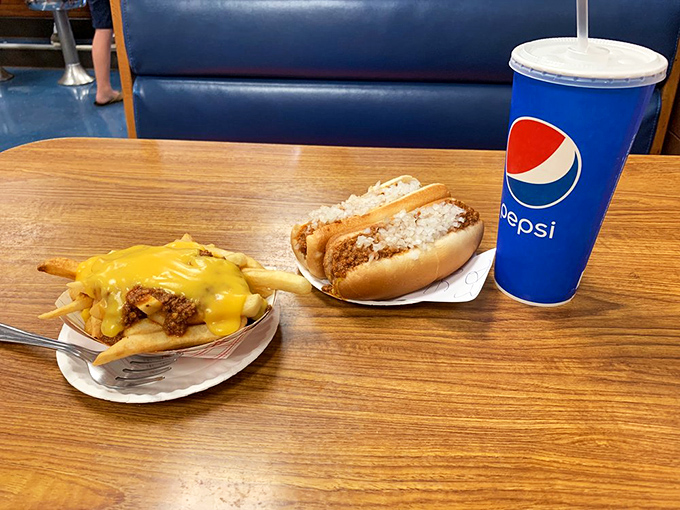 Cheese fries that don't apologize for being exactly what they are&mdash;crispy potatoes draped in molten cheese with that famous chili sauce for dipping