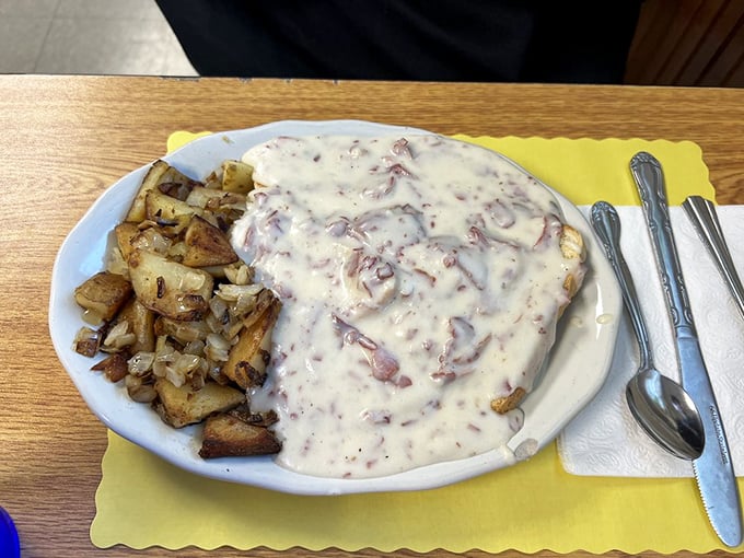 When sausage gravy cascades over golden potatoes like this, you don't just eat breakfast&mdash;you experience it. Worth every delicious calorie.