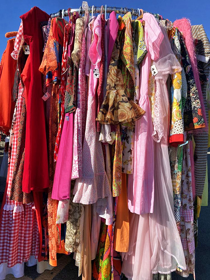 A rainbow of vintage frocks waiting for their second act&mdash;each dress carries whispers of parties, proms, and possibilities from decades past.