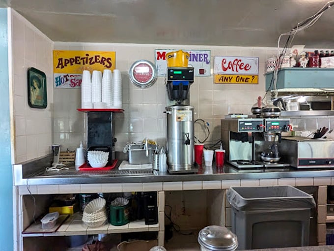 The coffee station &ndash; command central for the lifeblood of any respectable diner. That "COFFEE... ANY ONE?" sign isn't really asking a question.