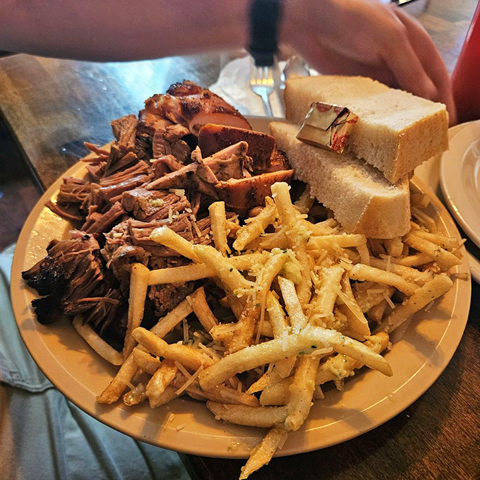 A meat lover's dream team assembled on one plate: pulled pork and beans alongside coleslaw that knows its supporting role is crucial to the production.