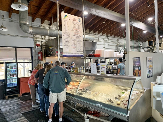 Where dreams begin: customers contemplating the day's catch. That seafood case is Florida's version of the Louvre.