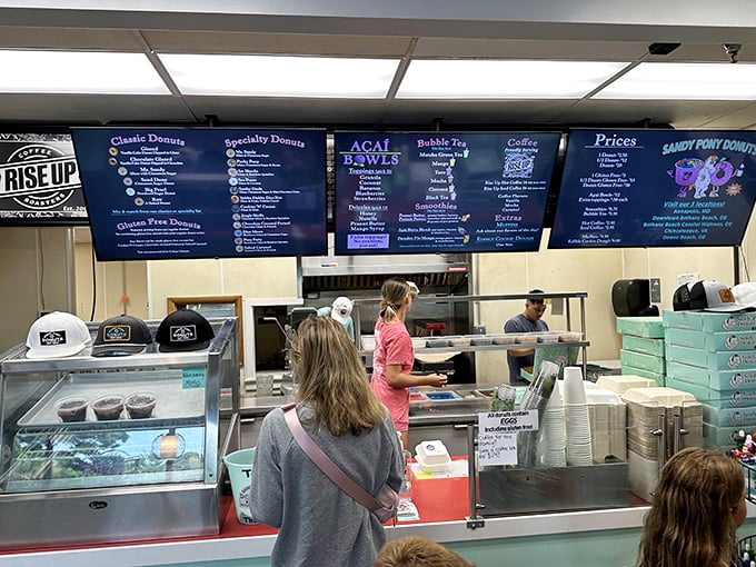 The front lines of donut warfare, where decisions are made and diets are forgotten. That menu board should come with a warning label.