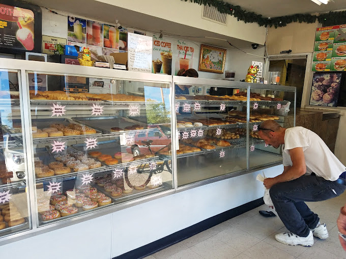 The friendly faces behind Phoenix's favorite donuts. Their smiles are almost as sweet as their creations.