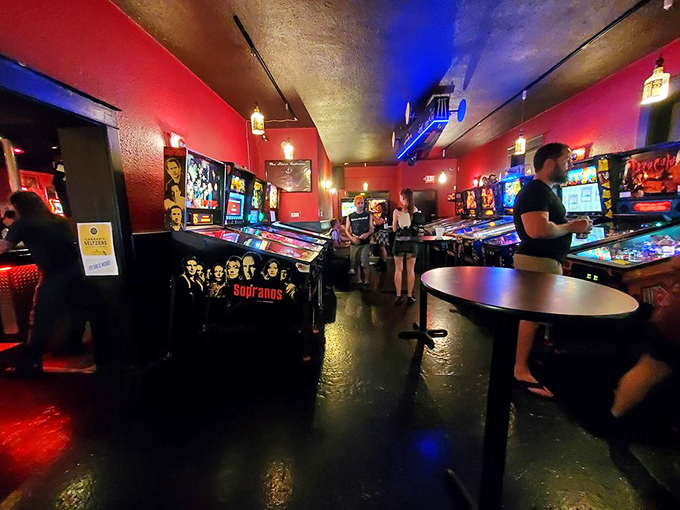 The Sopranos machine stands ready for action while patrons live out their flipper fantasies in this crimson-bathed playground for grown-ups.