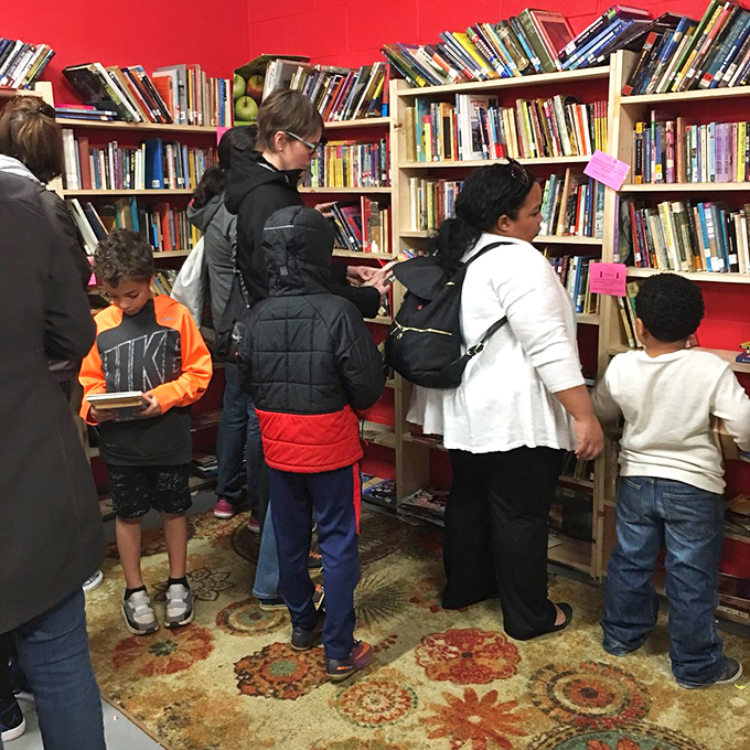 The children's section welcomes its smallest patrons, proving the joy of books starts early. Tomorrow's bibliophiles are born on this patterned rug.