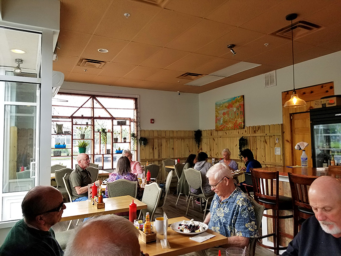 The dining room hums with the satisfied murmurs of locals who've discovered what visitors drive miles to experience. Breakfast democracy in action.