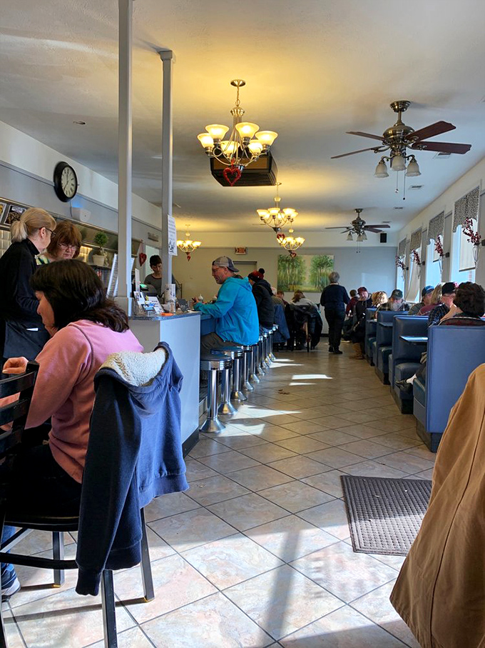 The bustling dining room where locals gather at counter seats and booths, proving some morning rituals are worth leaving home for.