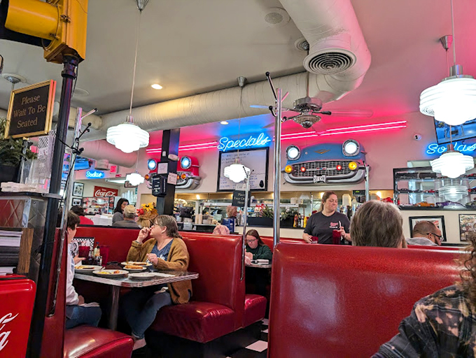 Red booths filled with locals who know the secret: calories don't count when you're sitting beneath neon lights and vintage memorabilia.