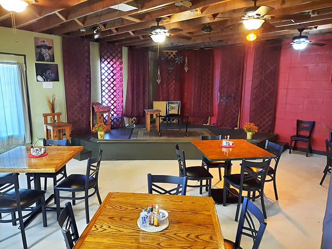 The dining area's red accent wall and wooden beams create the perfect backdrop for the serious business of breakfast consumption.