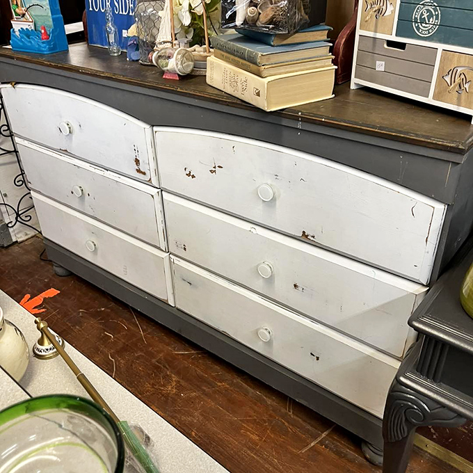 This weathered dresser has witnessed decades of morning routines and late-night searches – now waiting for its next chapter in someone's home.