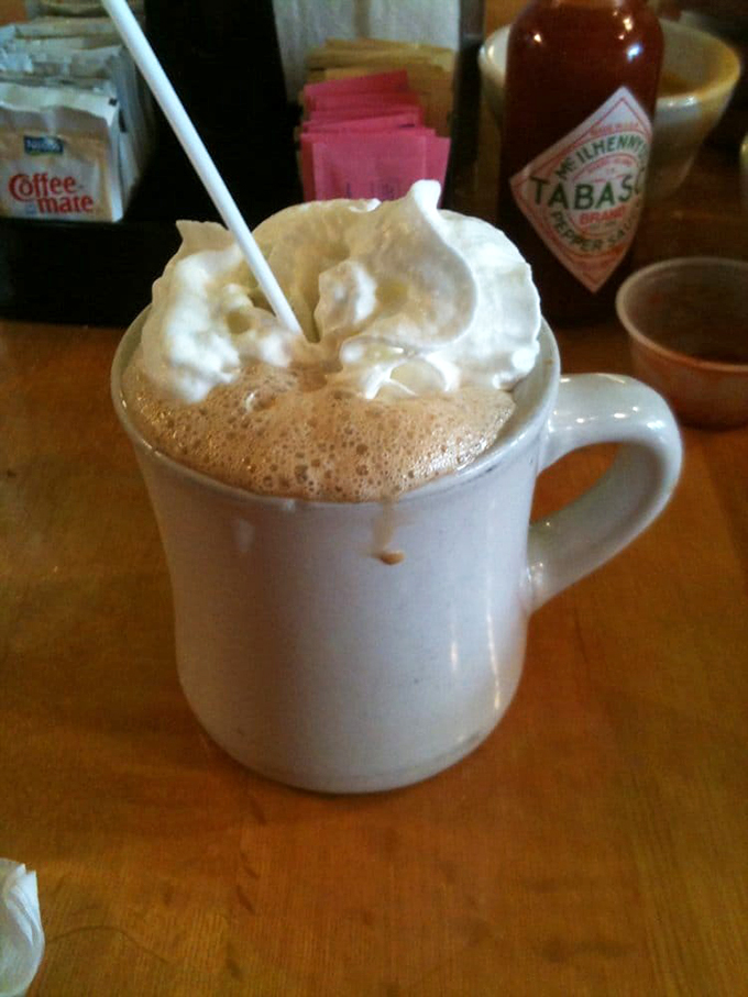 This isn't just hot chocolate&mdash;it's a warm hug in a mug, topped with a cloud of whipped cream that melts into the cinnamon-spiced goodness below.