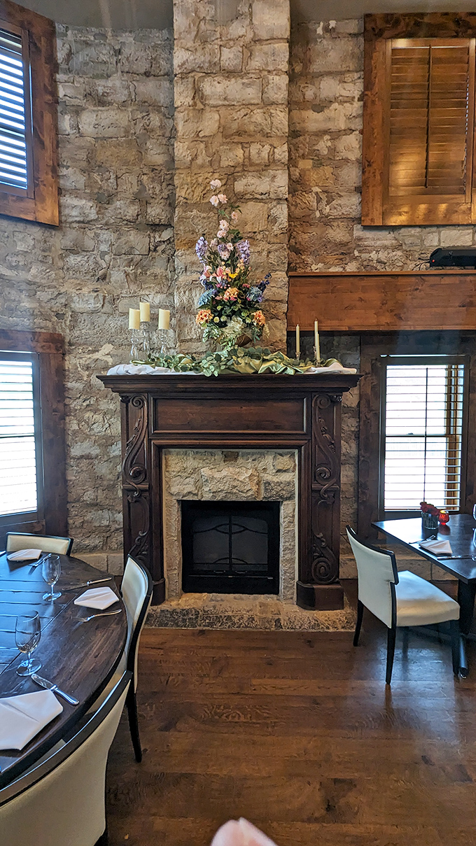 This isn't just a fireplace; it's a time portal framed in carved wood where you half expect to see messages arrive via smoke signal.