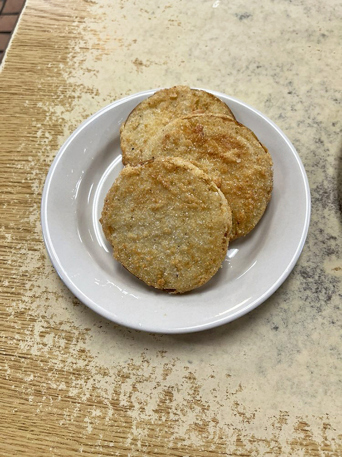 Fried green tomatoes: the unsung heroes of Southern cuisine. Crispy, tangy discs of happiness that make salads look like they're not even trying.