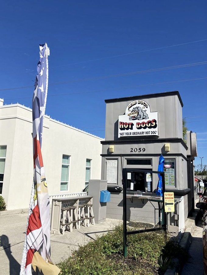 The American flag flutters beside this hot dog haven, as if to say, "Few things are more patriotic than celebrating regional cuisine differences."