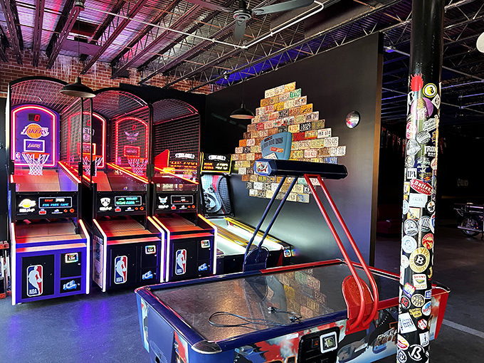 The boxing game stands ready for challengers while multiple gaming options await in this nostalgic corner that's equal parts Vegas and childhood arcade.