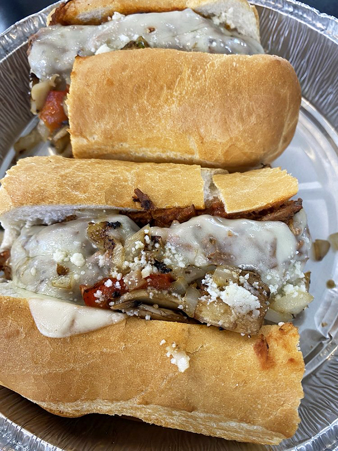 A sandwich architecture so structurally sound it could be studied at MIT, with layers of meat, cheese, and vegetables achieving perfect balance.