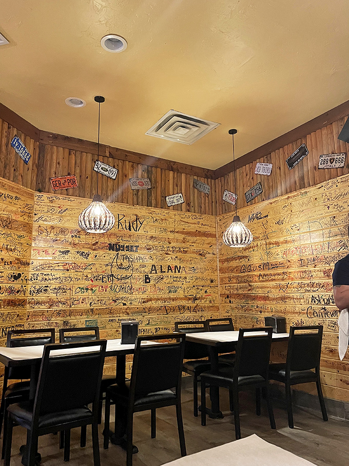 Wooden walls covered in guest signatures tell stories of seafood pilgrimages past. Like a maritime high school yearbook, but with better lighting.