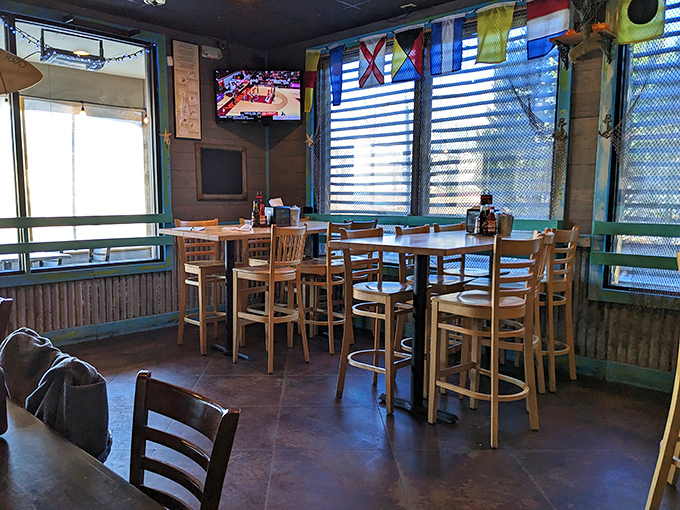 Colorful nautical flags and warm wood tones create the perfect backdrop for seafood adventures &ndash; no passport or seasickness required.