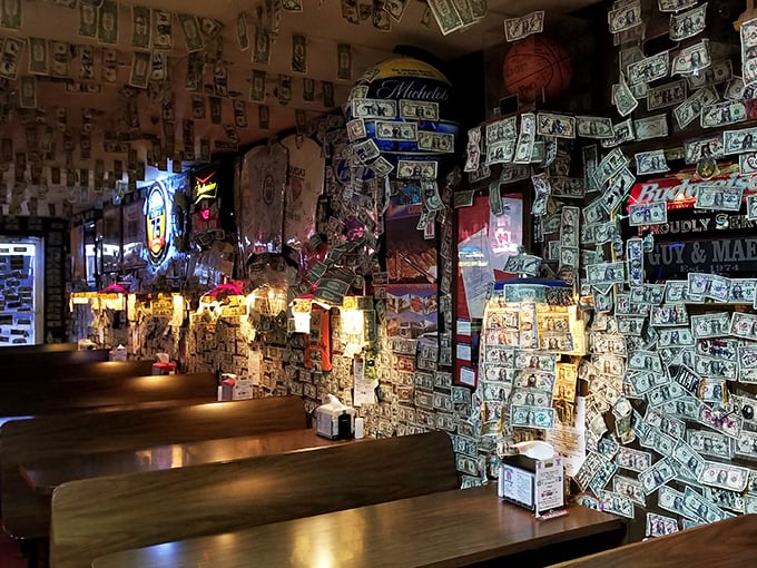The dollar-decorated walls tell stories of visitors past. Each bill a memory, each signature a testament to ribs worth remembering and a place worth returning to.
