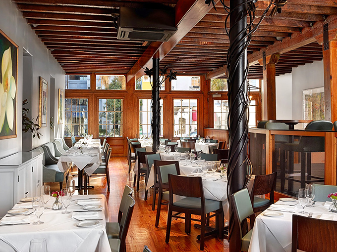 Sunlight streams through windows onto white tablecloths, turning an ordinary lunch into the kind of memory that makes you smile randomly weeks later.