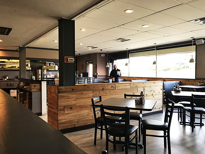 The interior balances rustic wooden elements with practical comfort - like your favorite aunt's dining room if she secretly trained in New Orleans.