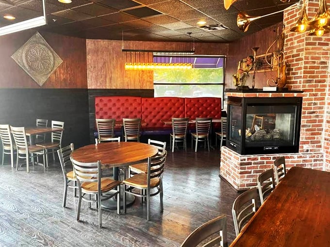The exposed brick and fireplace create that perfect "come stay awhile" vibe that makes you want to order everything and cancel your evening plans.