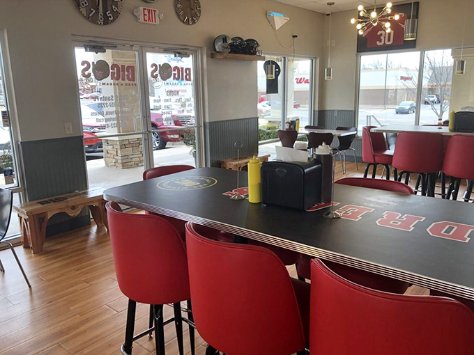 Modern comfort meets barbecue tradition in this thoughtfully designed space. The red chairs aren't just stylish&mdash;they're practical for hiding sauce splatters.